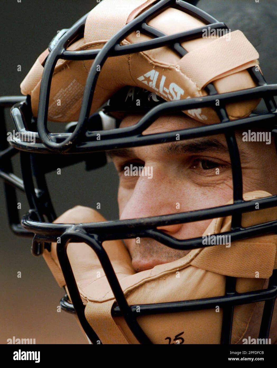 New York Yankees catcher Joe Girardi peer through his mask during ...