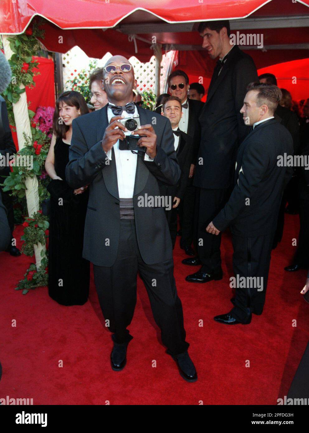 Actor Samuel L. Jackson smiles after taking a picture of the media ...