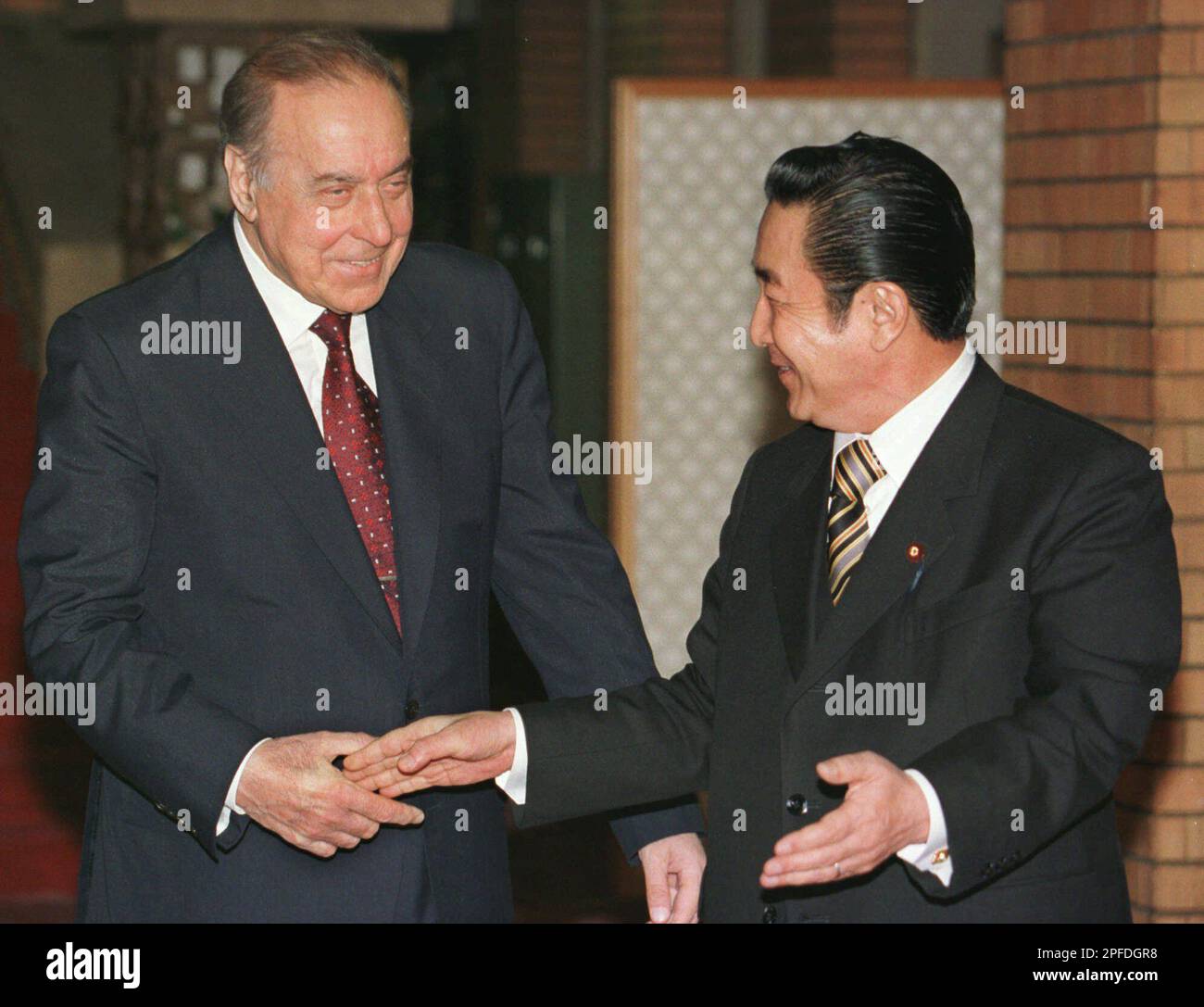 Azerbaijan President Heydar Aliyev, left, shakes hand with Japanese ...