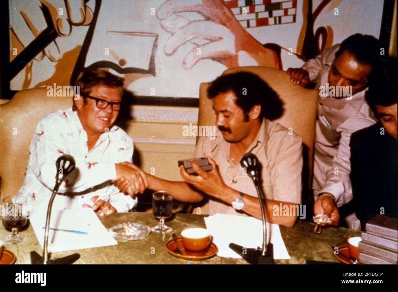 Billy Carter, left, shakes hands with the mayor of Tripoli in a ...