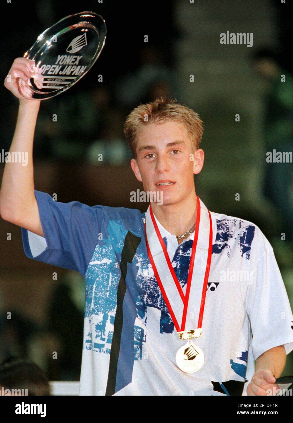 Denmark's Peter Gade Christensen displays his trophy during the ...