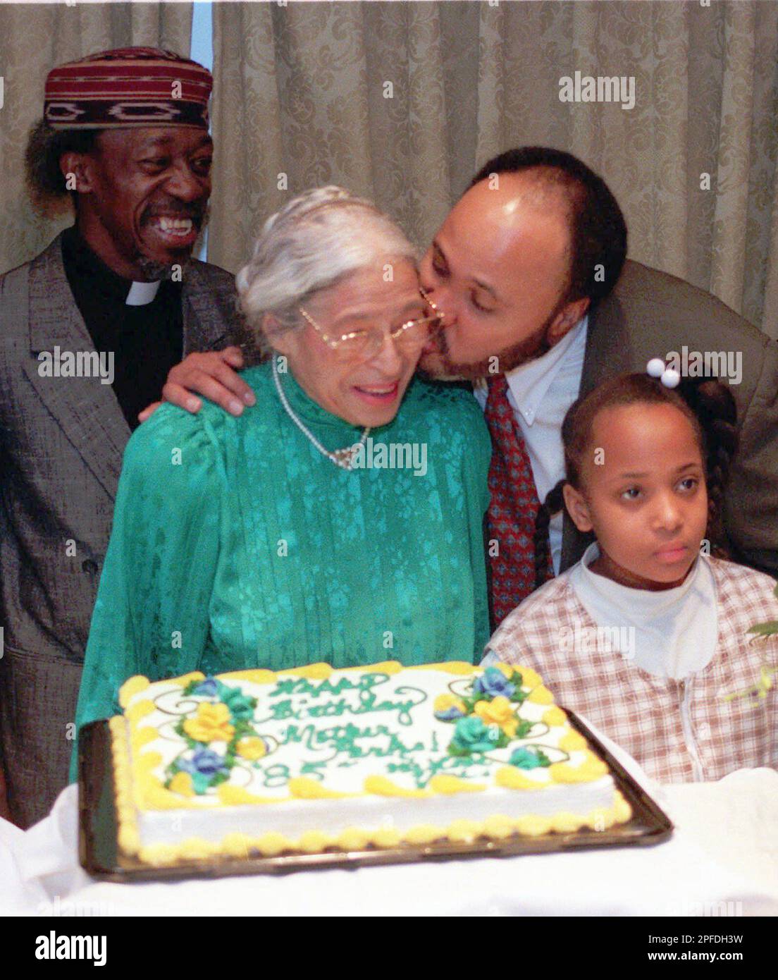 Martin Luther King III kisses civil rights activist Rosa Parks during ...