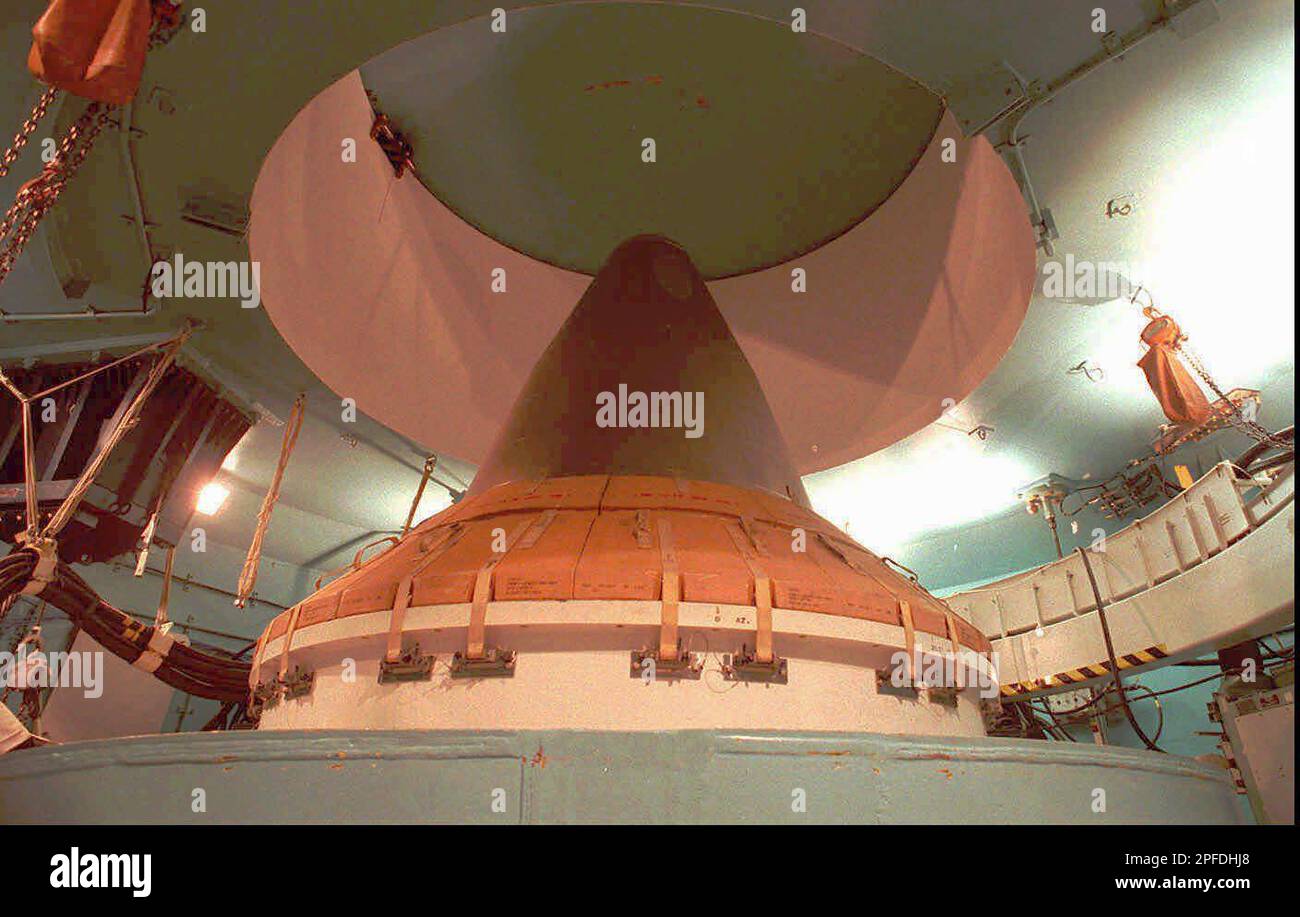 The tip of a Peacekeeper missile protrudes from its silo at Hill Air ...