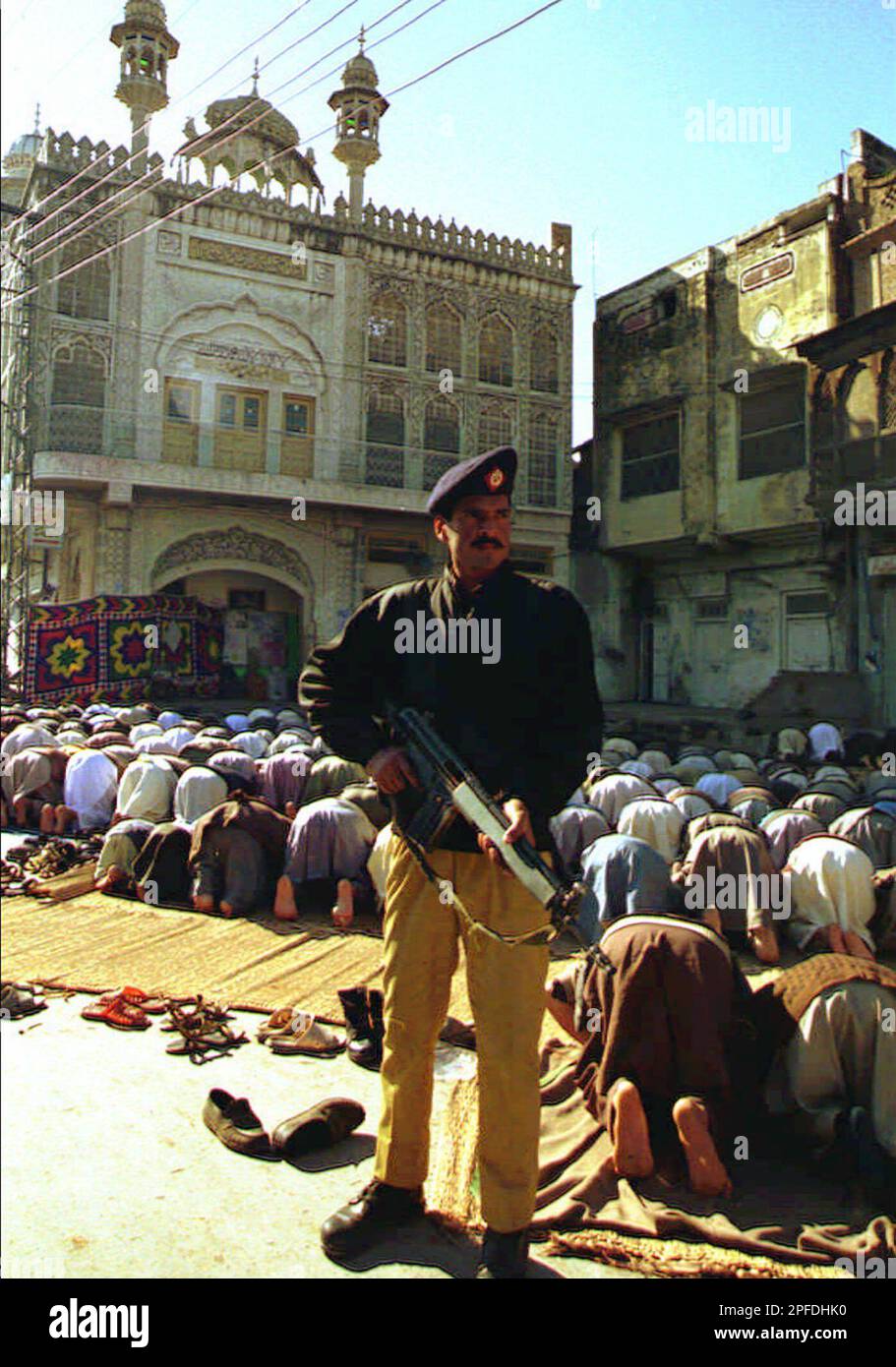 Armed police officer stands guard the main Sunni Muslim mosque in ...