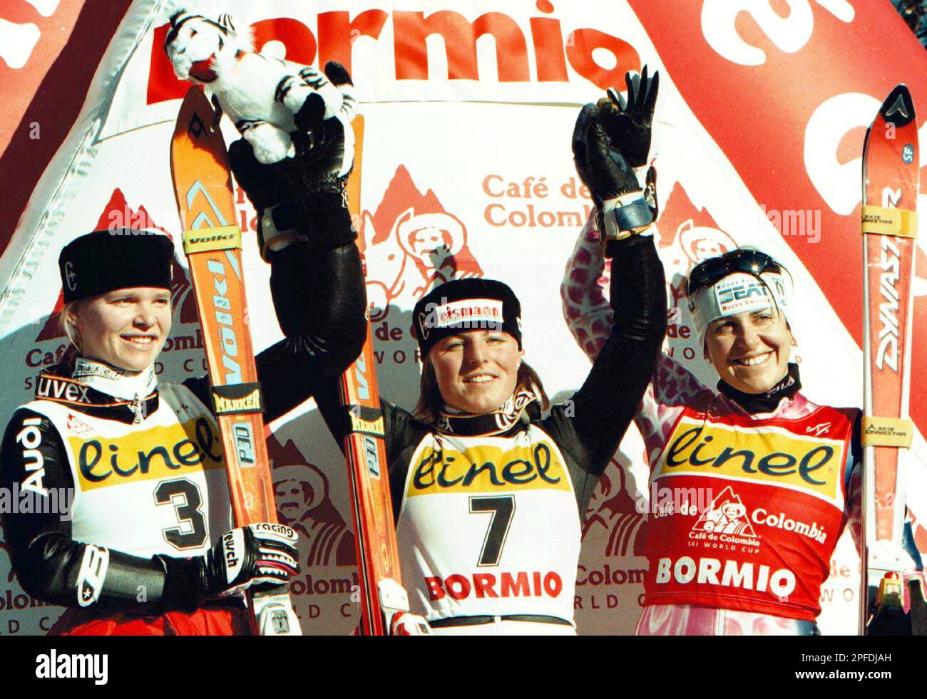 Winner of the World Cup women's slalom Martina Ertl of Germany, center ...