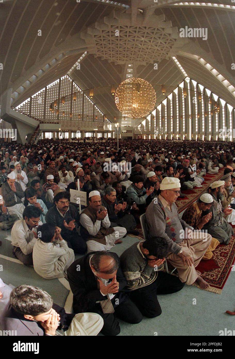 A crowd of Muslim worshippers offer prayer to mark the second Friday of ...