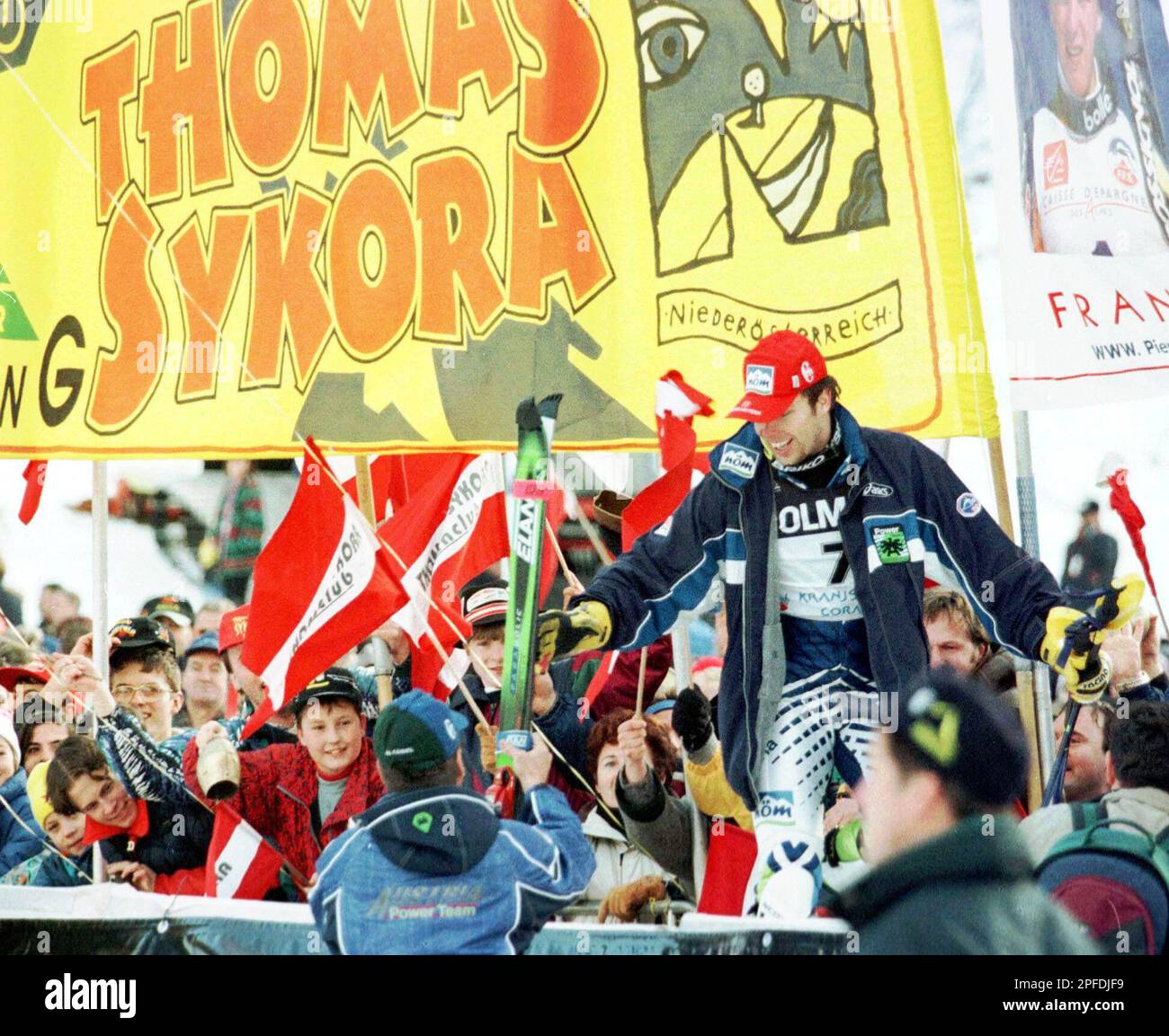 Austria's Thomas Sykora is celebrated by fans in the finish area after ...