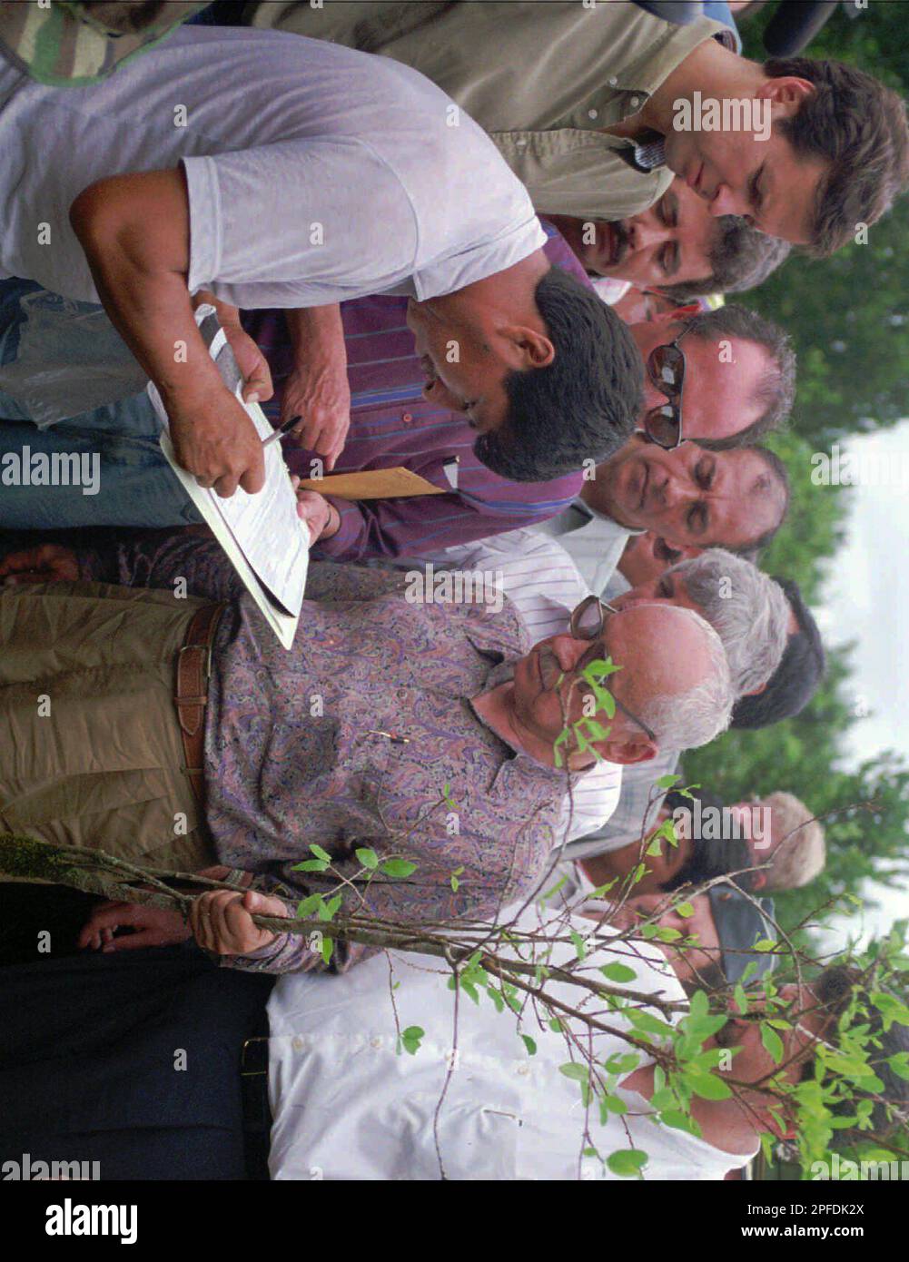 A coca farmer signs a document agreeing to the destruction of coca ...