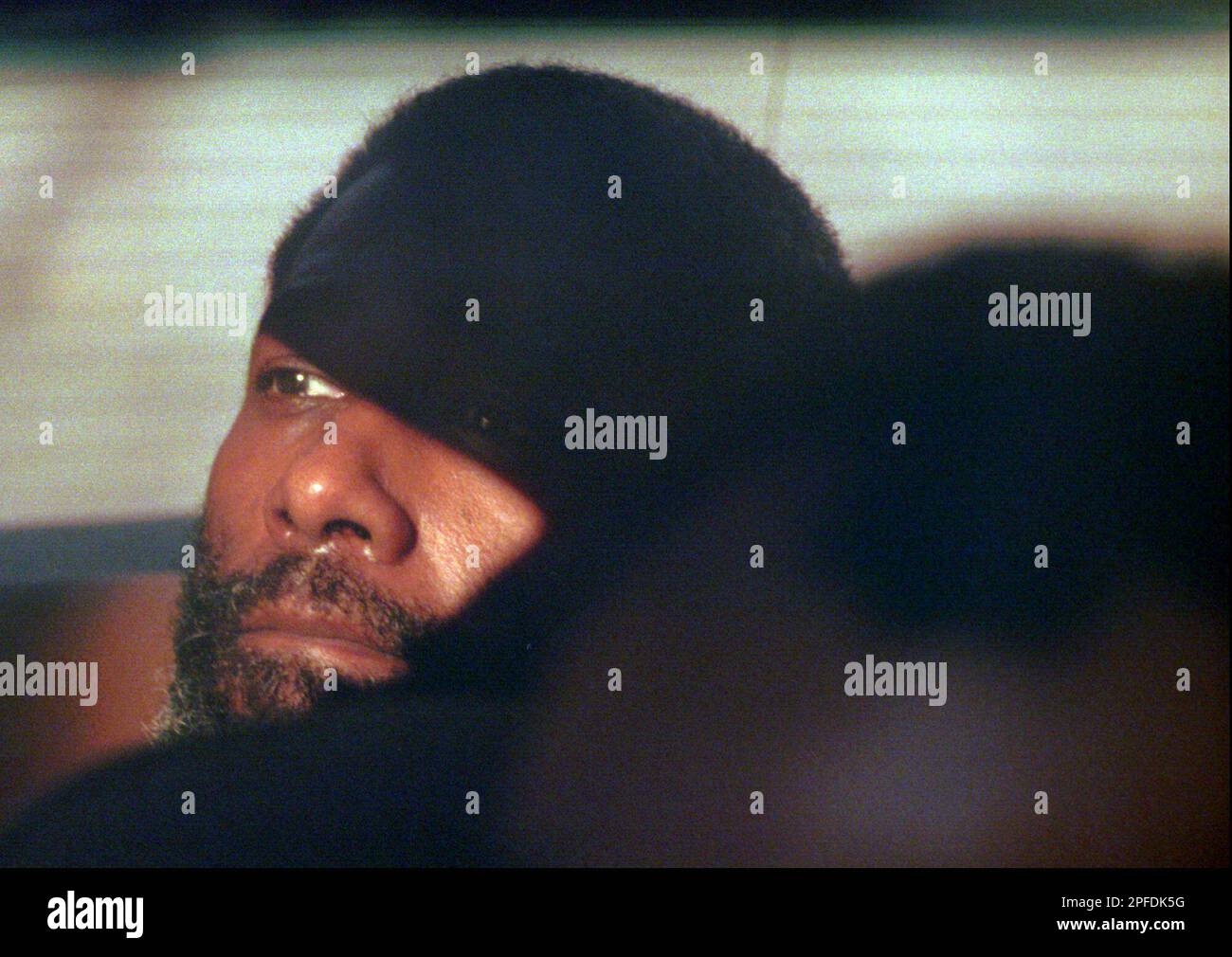 Accused murderer Arthur Bowmar is seen in a patrol car after leaving ...