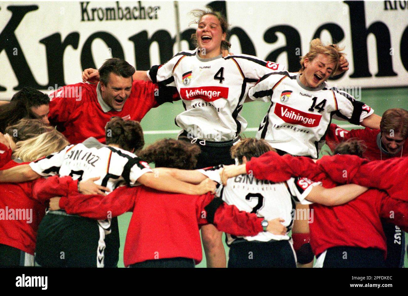 The players and the coach of the German team celebrate their third ...