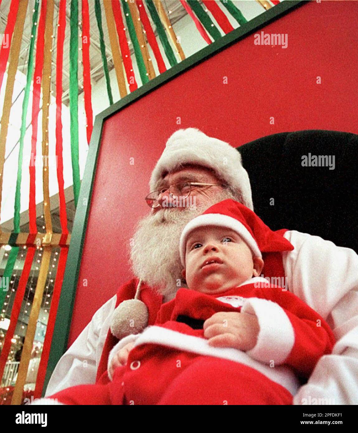 Three-month-old Wyatt Boehm makes his first trip to see Santa Claus ...