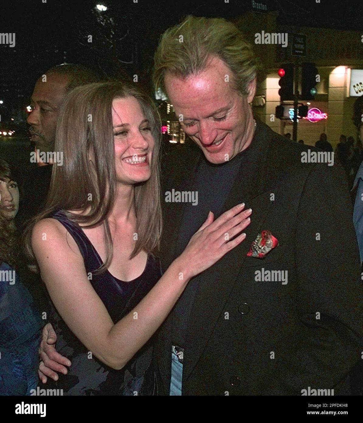 Actress Bridget Fonda embraces her dad Peter Fonda while arriving for ...