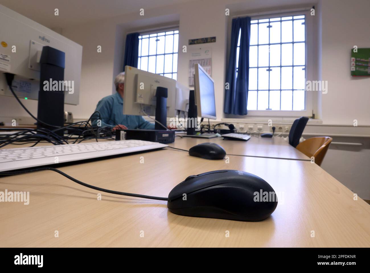 09 March 2023, Bavaria, Würzburg: A student prisoner sits at a computer ...