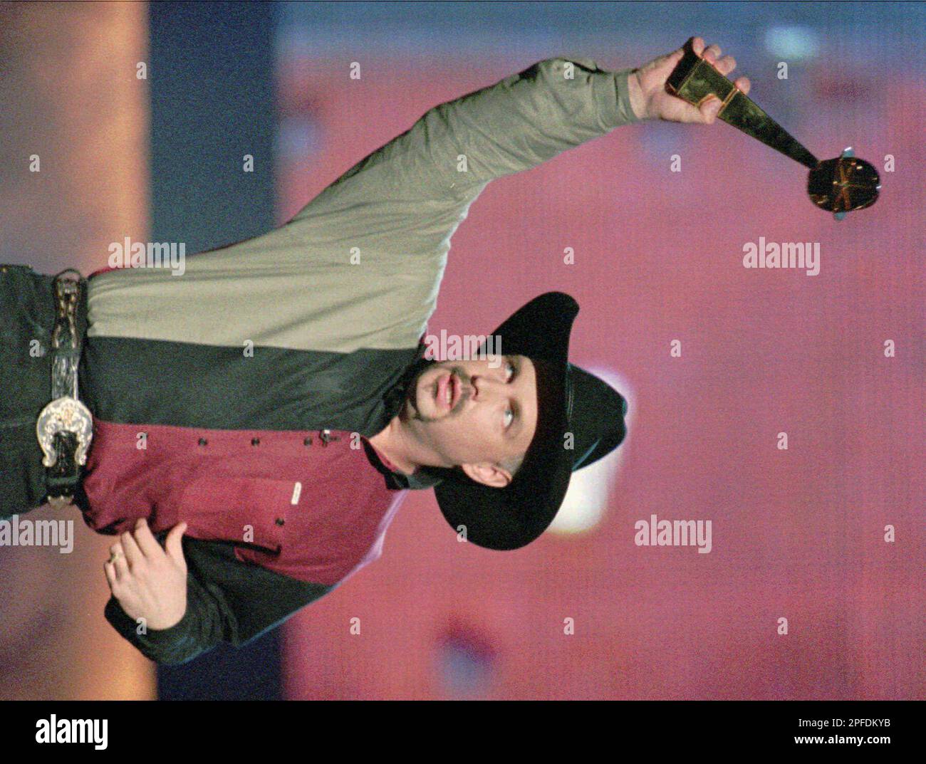 Country singer Garth Brooks holds his Artist Achievement Award high ...