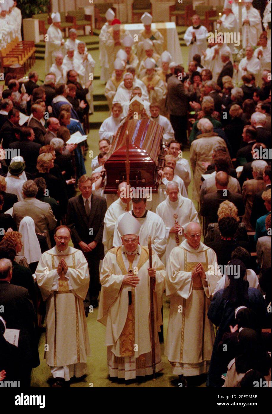 Cardinal Bernard Law, front, center, leads the funeral procession ...
