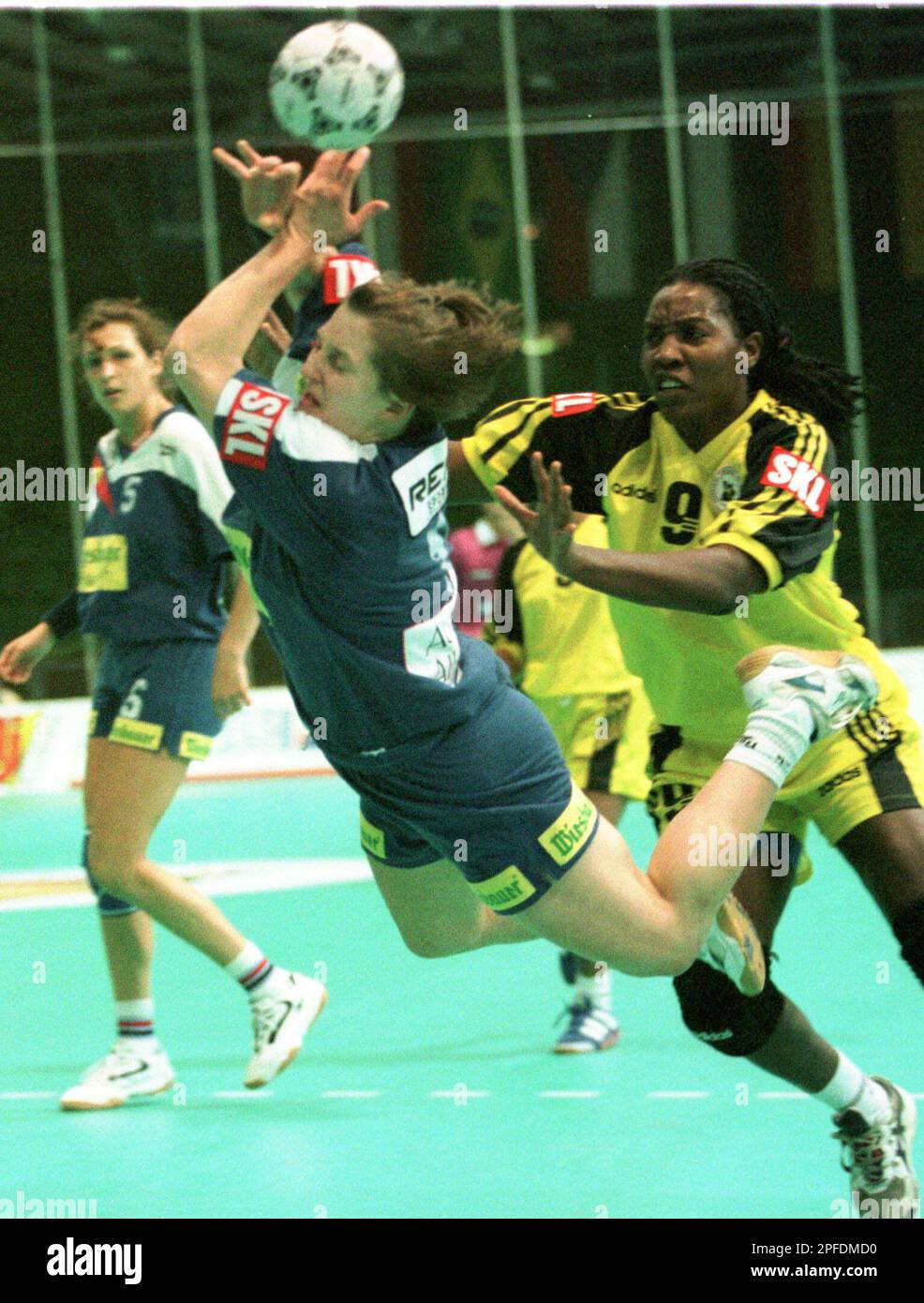 Angola's Elisa Webba, right, holds the arm of Austria's Barbara Strass ...