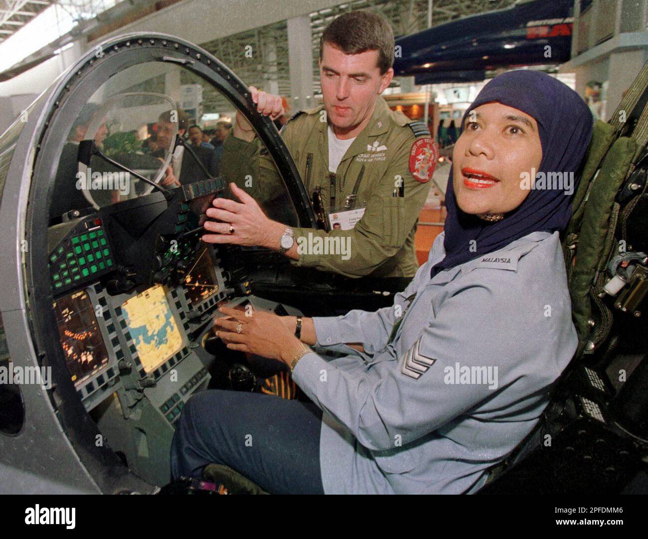Malaysian Air Force Sergt. Zaharah Ibrahim sits in the cockpit of a ...