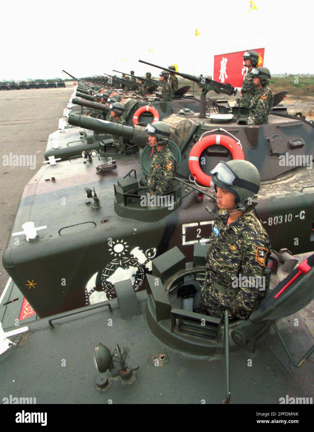 Taiwanese Marine Corps drivers and crew stand at attention aboard their ...