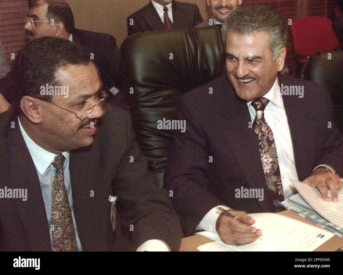 Kuwaiti Minister of Oil Issa Mohammed Al-Mazidi, right, chats with an ...