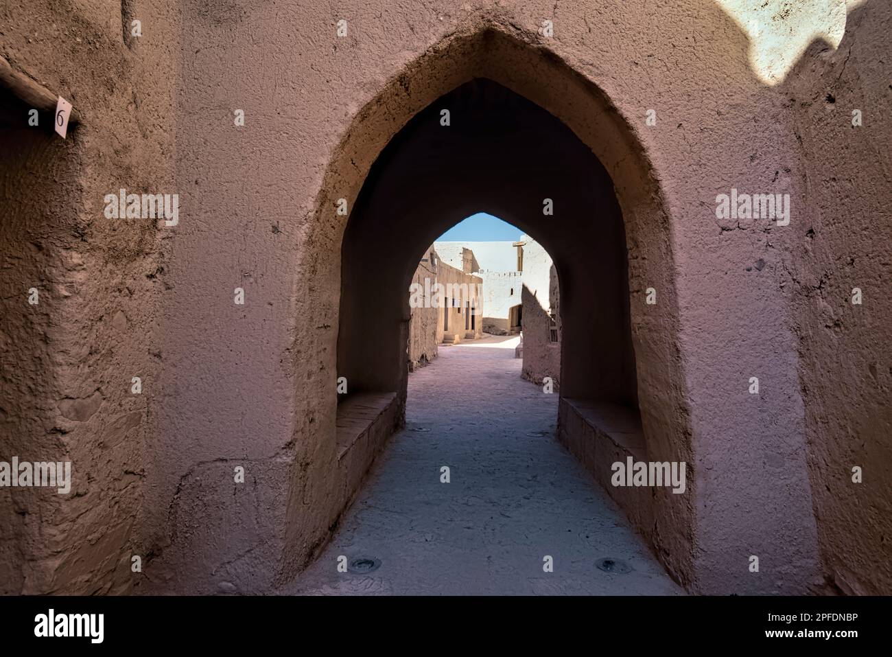 Archway in the abandoned mud brick village of Harat al Bilad, Manah ...
