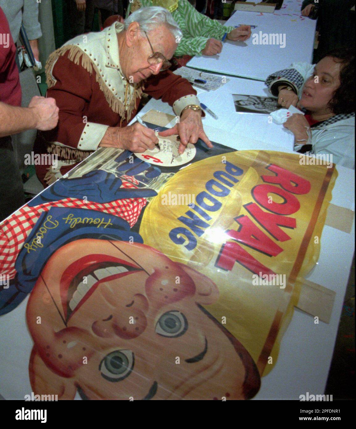 Susan Kaplan, of Brookline, Mass., right, waits for an autograph from ...