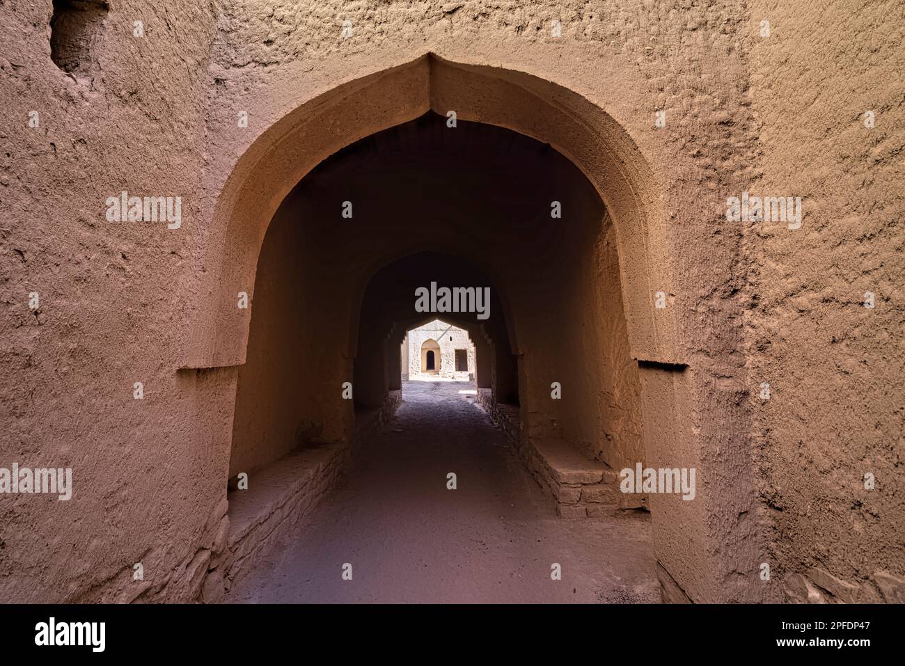 Archway in the abandoned mud brick village of Harat al Bilad, Manah ...