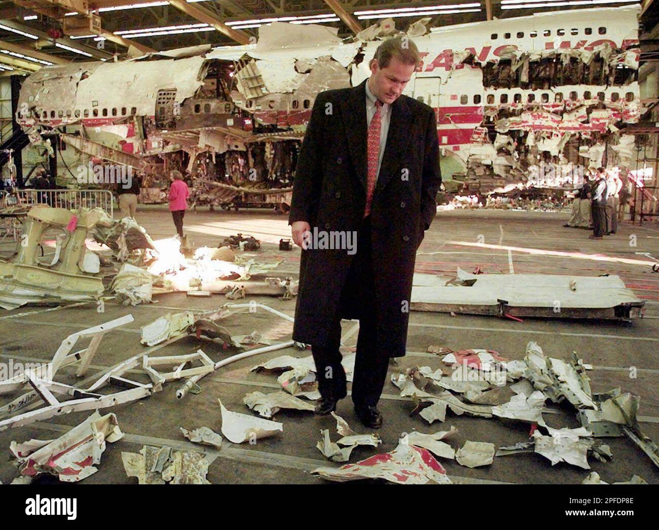 Joe Lychner of Houston, Tx., walks among fragments of TWA Flight 800 in ...