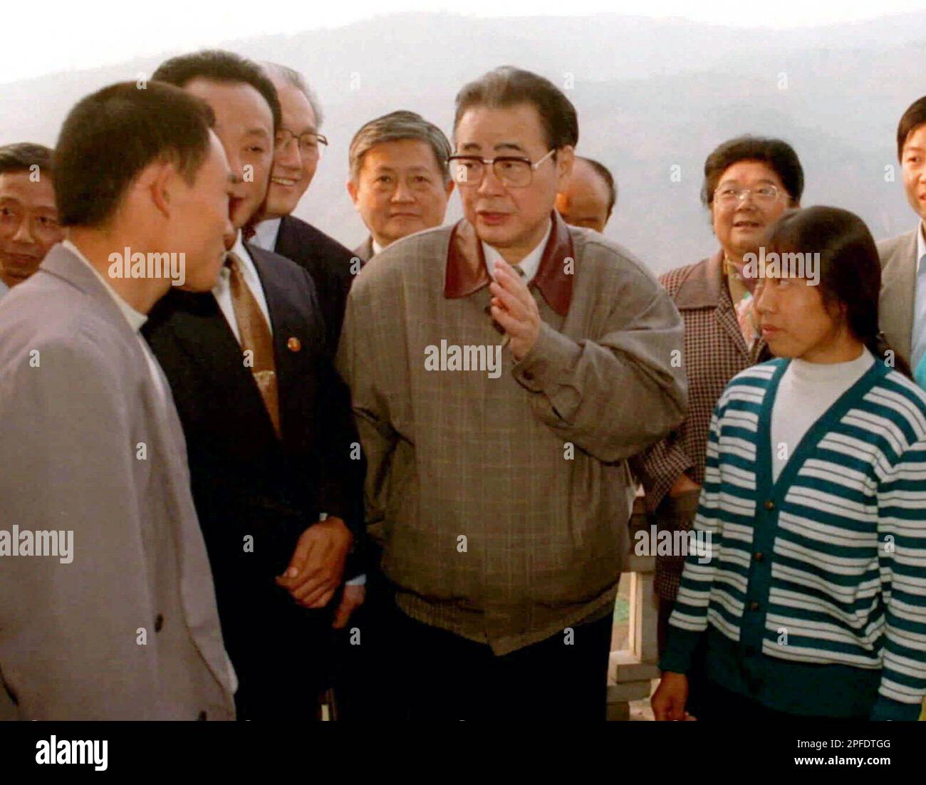 Chinese Premier Li Peng meets with new residents of Shiyan Village in ...