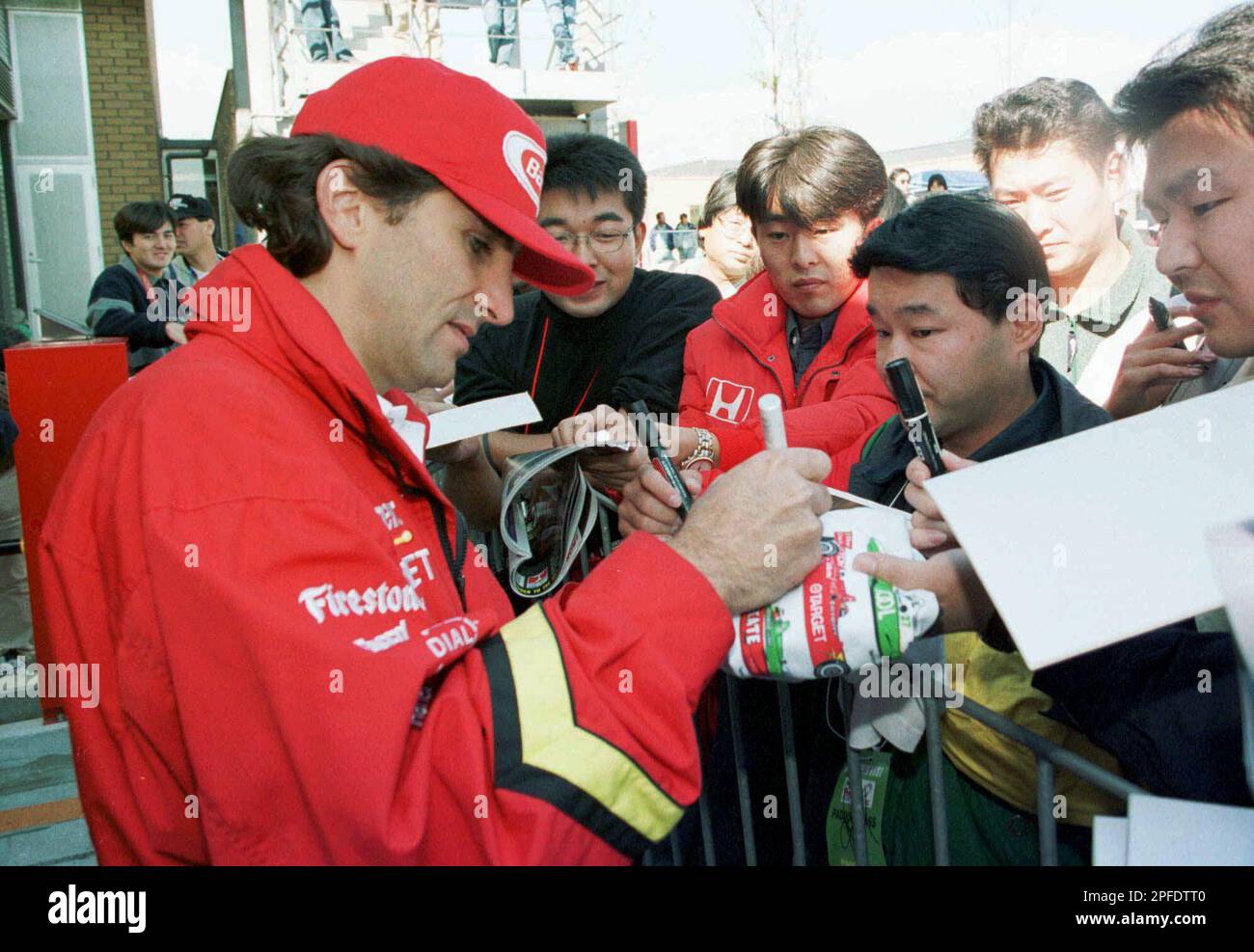 PPG CART World Series champion Alex Zanardi, of Italy, signs autographs ...