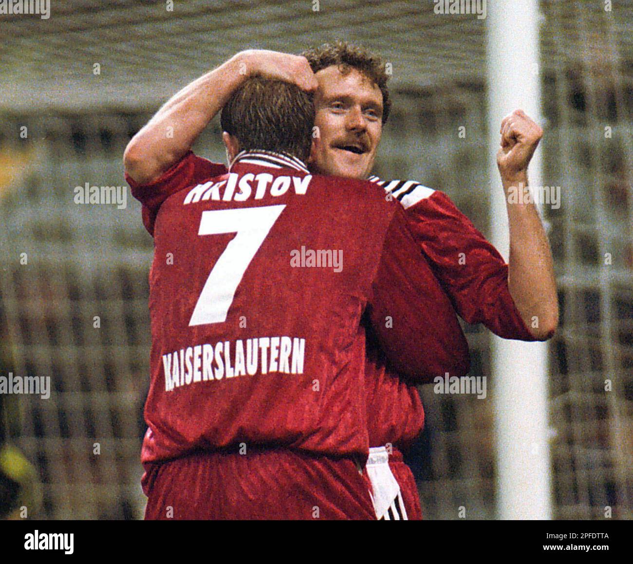 Marian Hristov of Kaiserlautern embraces his teammate Olaf Marschall ...