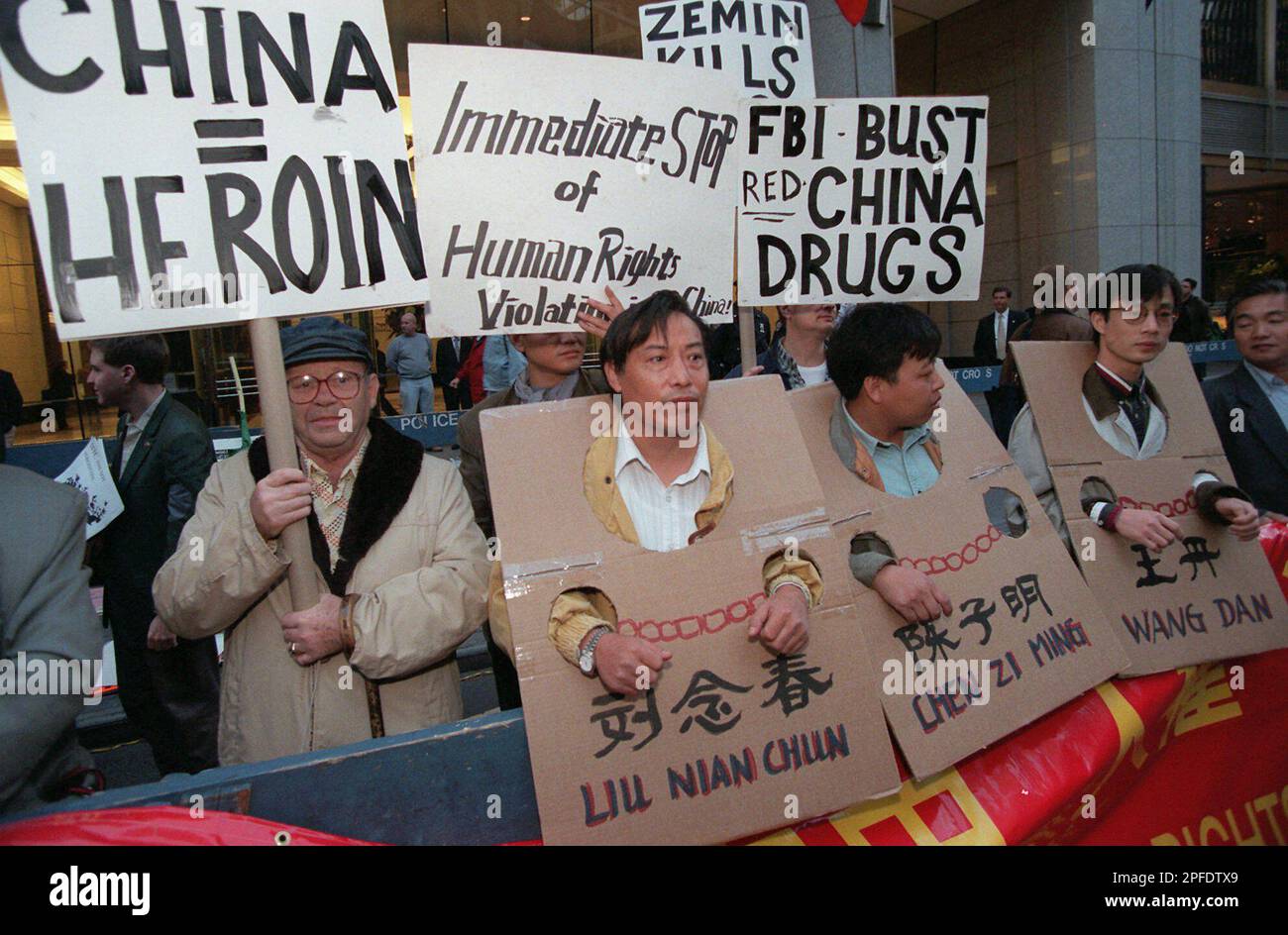 Protesters critical of Chinese President Jiang Zemin gather outside the ...