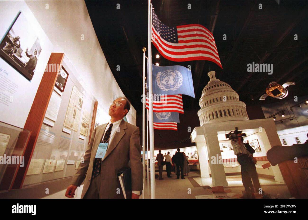 T.C. Hu, Houston correspondent for Central News Agency of Tawain, looks ...