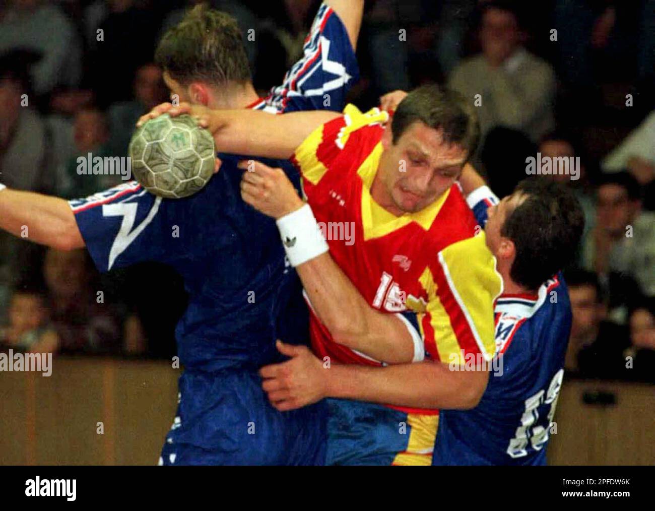 Andriy Chtchepkine, center, of Spain tries to come through the Slovak ...