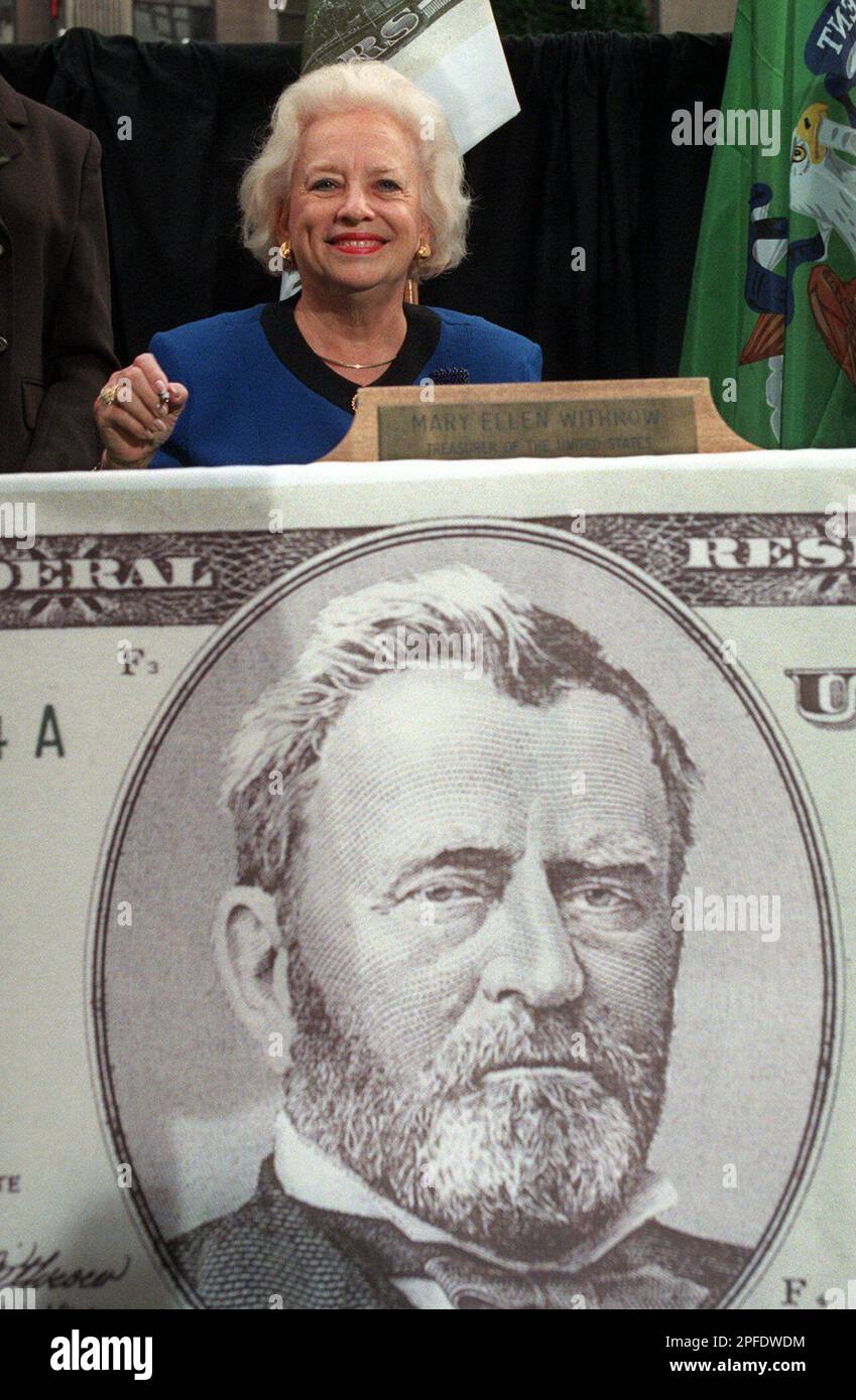 U.S. Treasurer Mary Ellen Withrow stands behind a reproduction of the ...