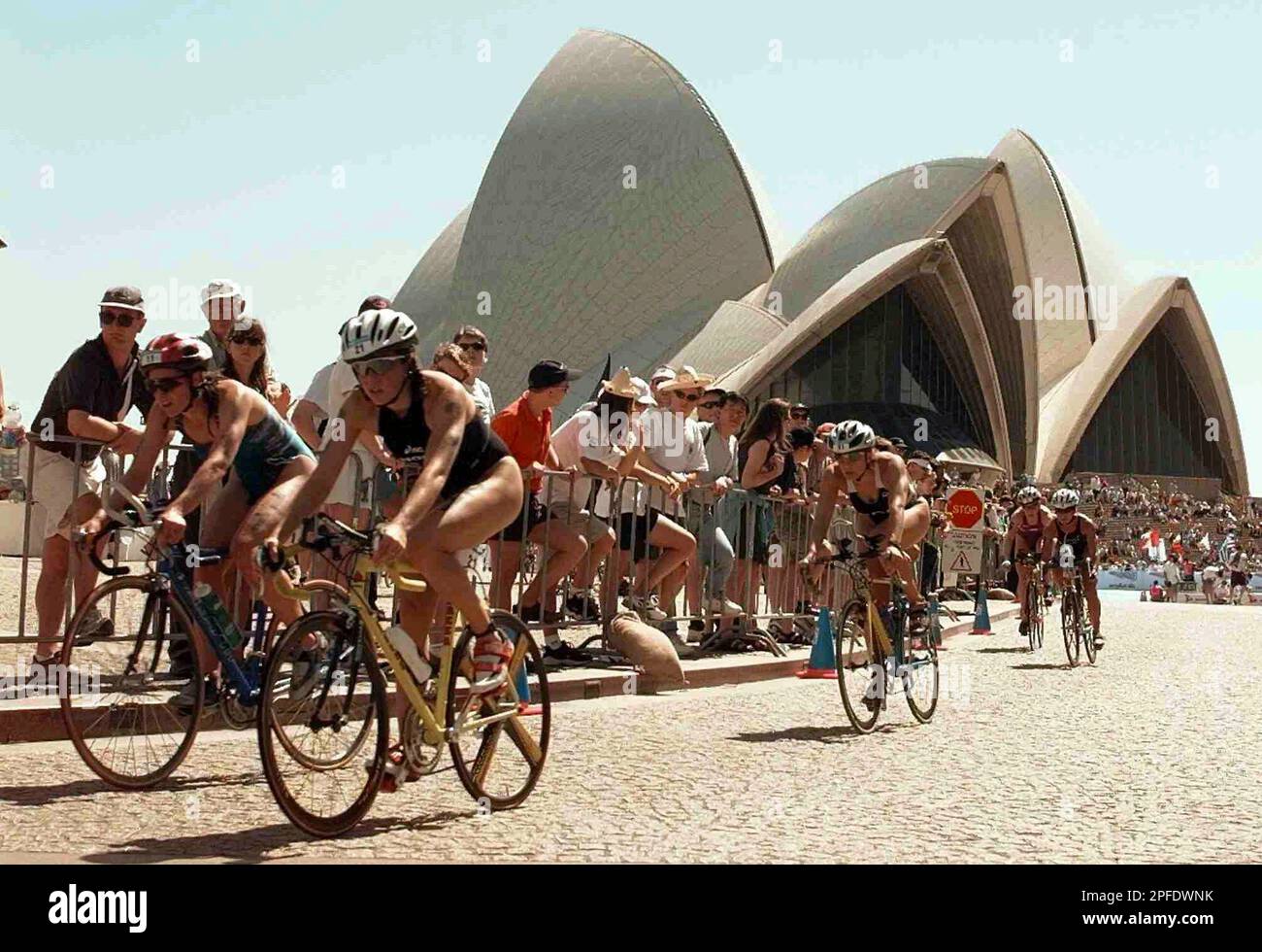 Female competitors for the Triathlon World Cup pedal their bicycles ...