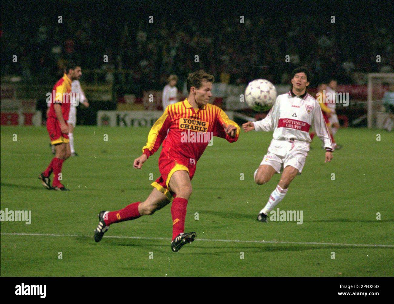 Belgian FC Ekeren's Jan Moons, left, runs for the ball as German VfB ...