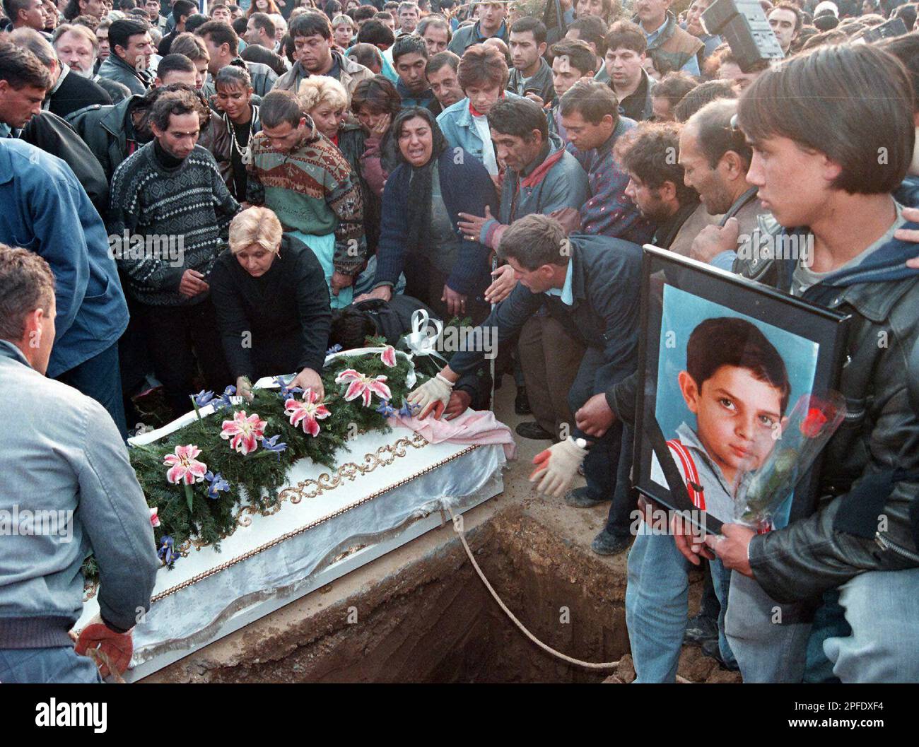 Mourners attend the funeral of a 13-year-old gypsy boy Dusan Jovanovic who was murdered by ...