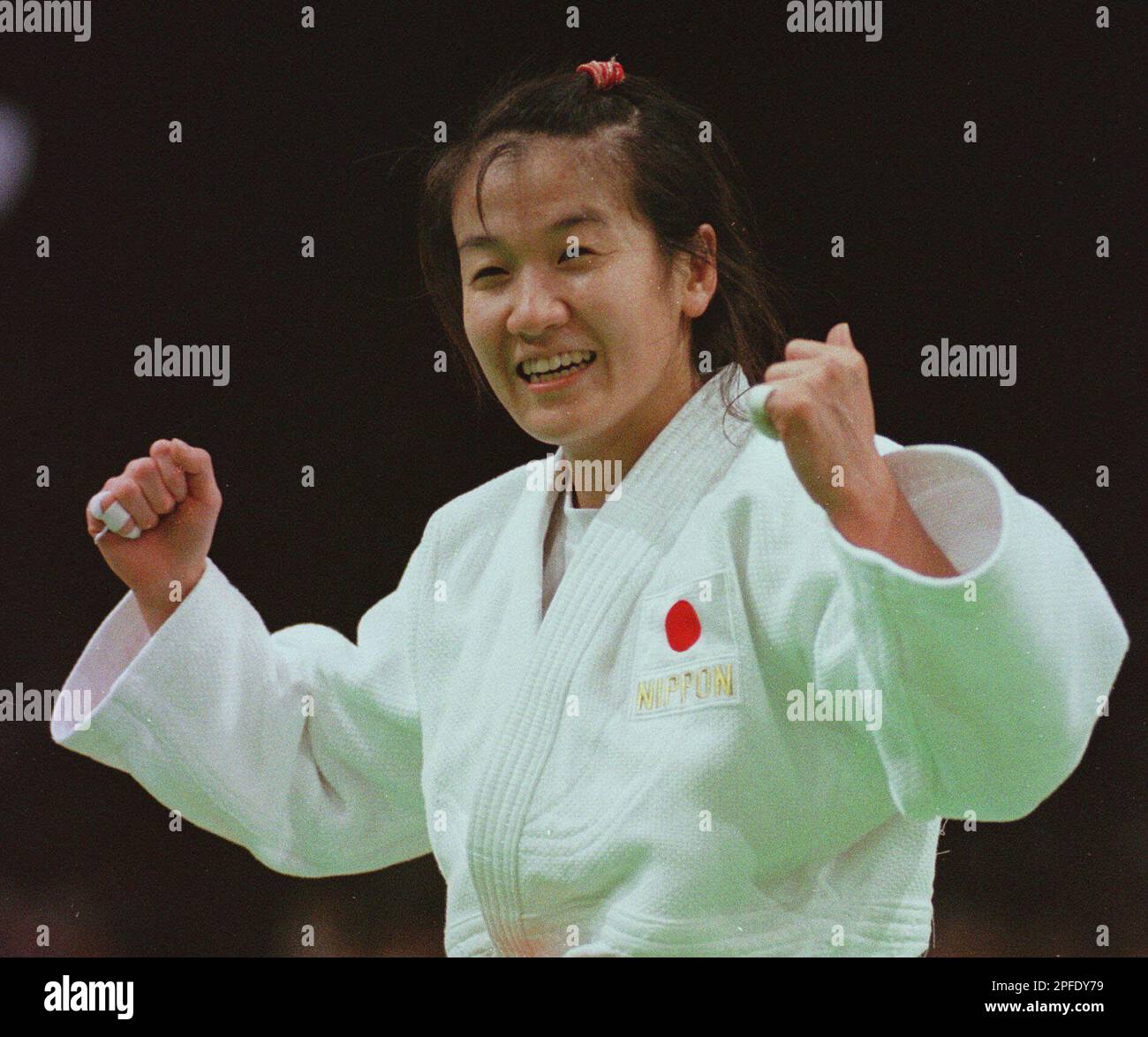 Ryoko Tamura of Japan reacts after she won the gold medal in the under ...