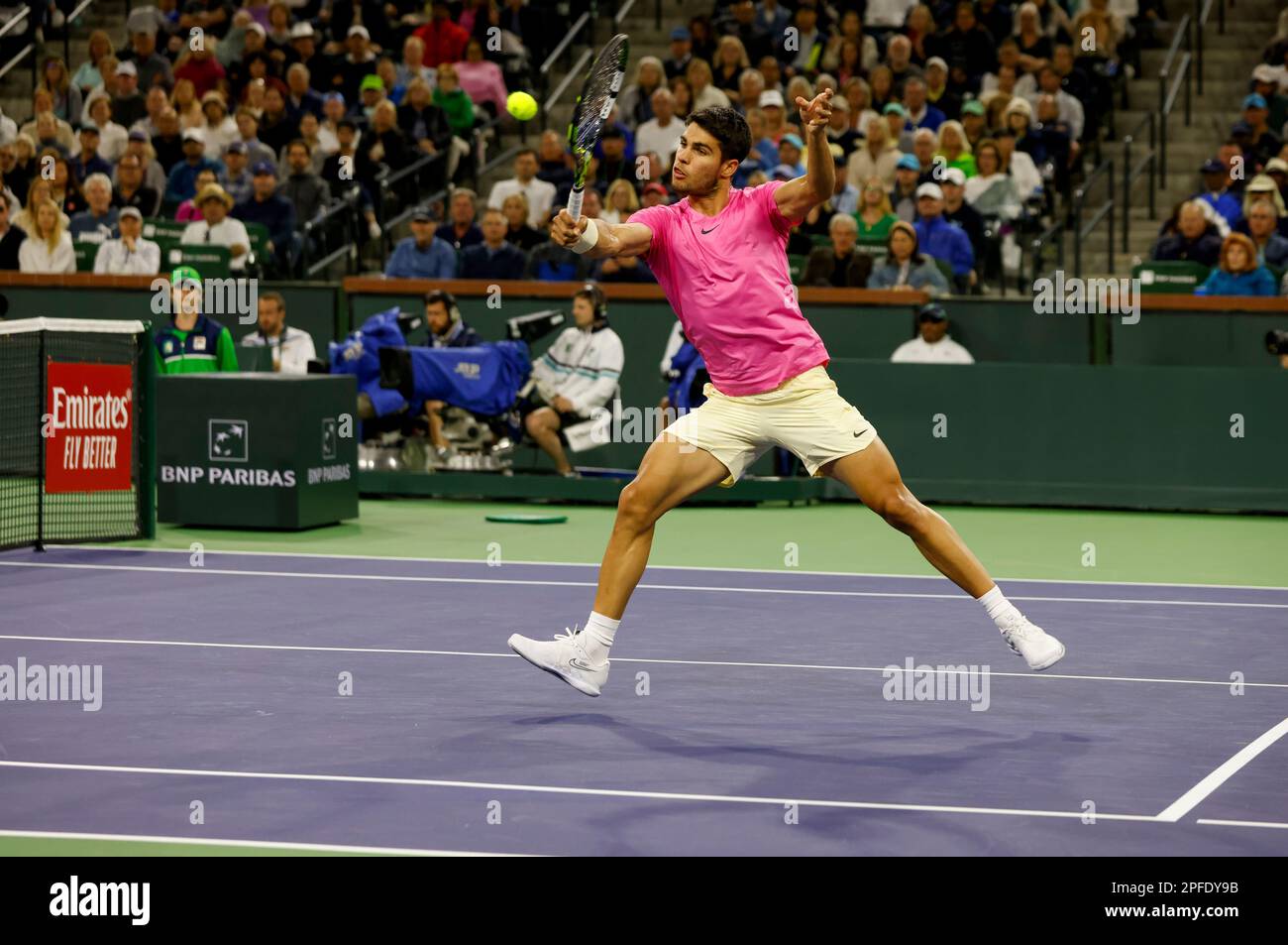 March 16, 2023 Carlos Alcaraz of Spain returns a shot against Felix Auger-Aliassime of Canada ...