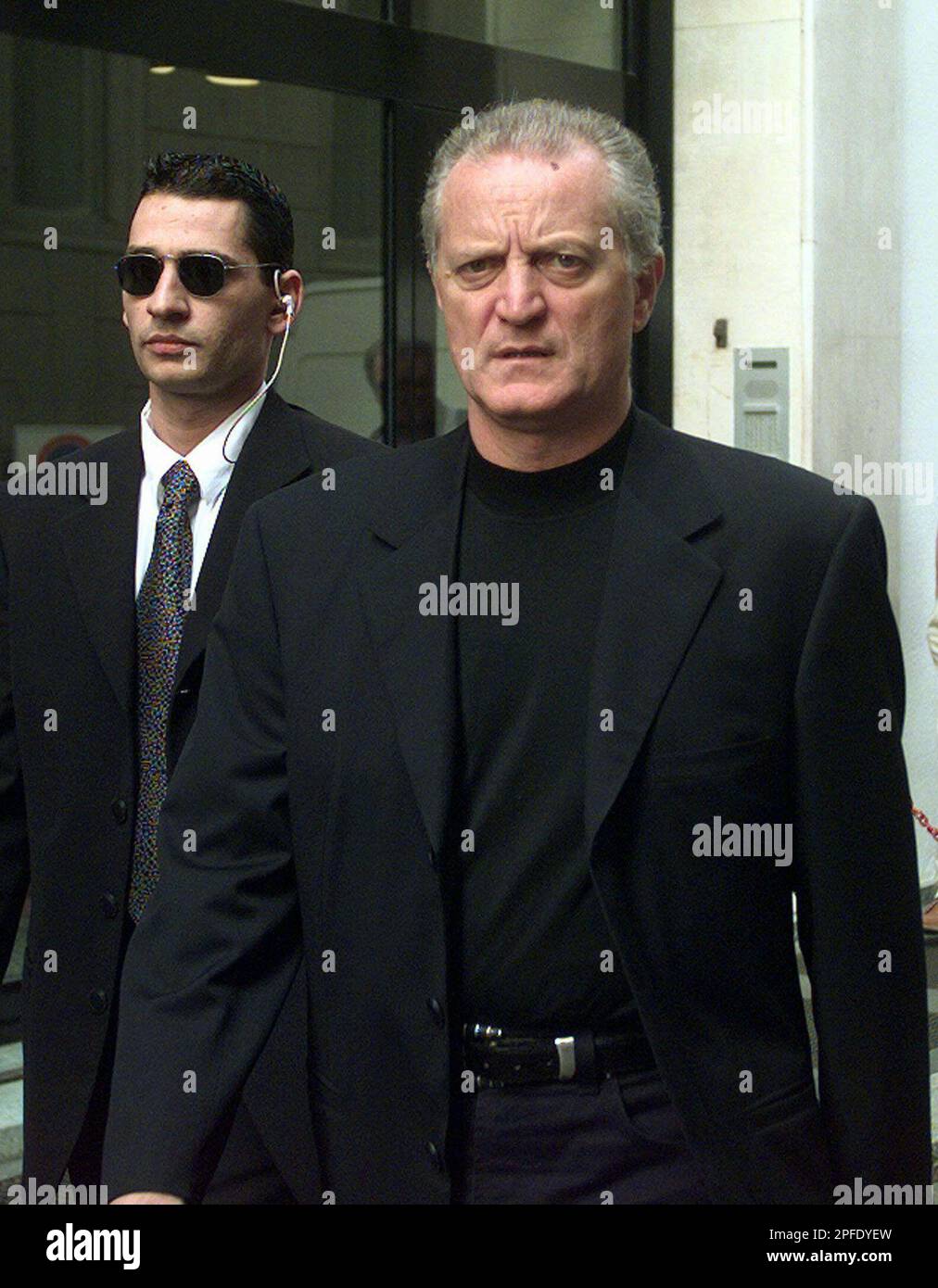 Santo Versace, the brother of slain designer Gianni, followed by a ...