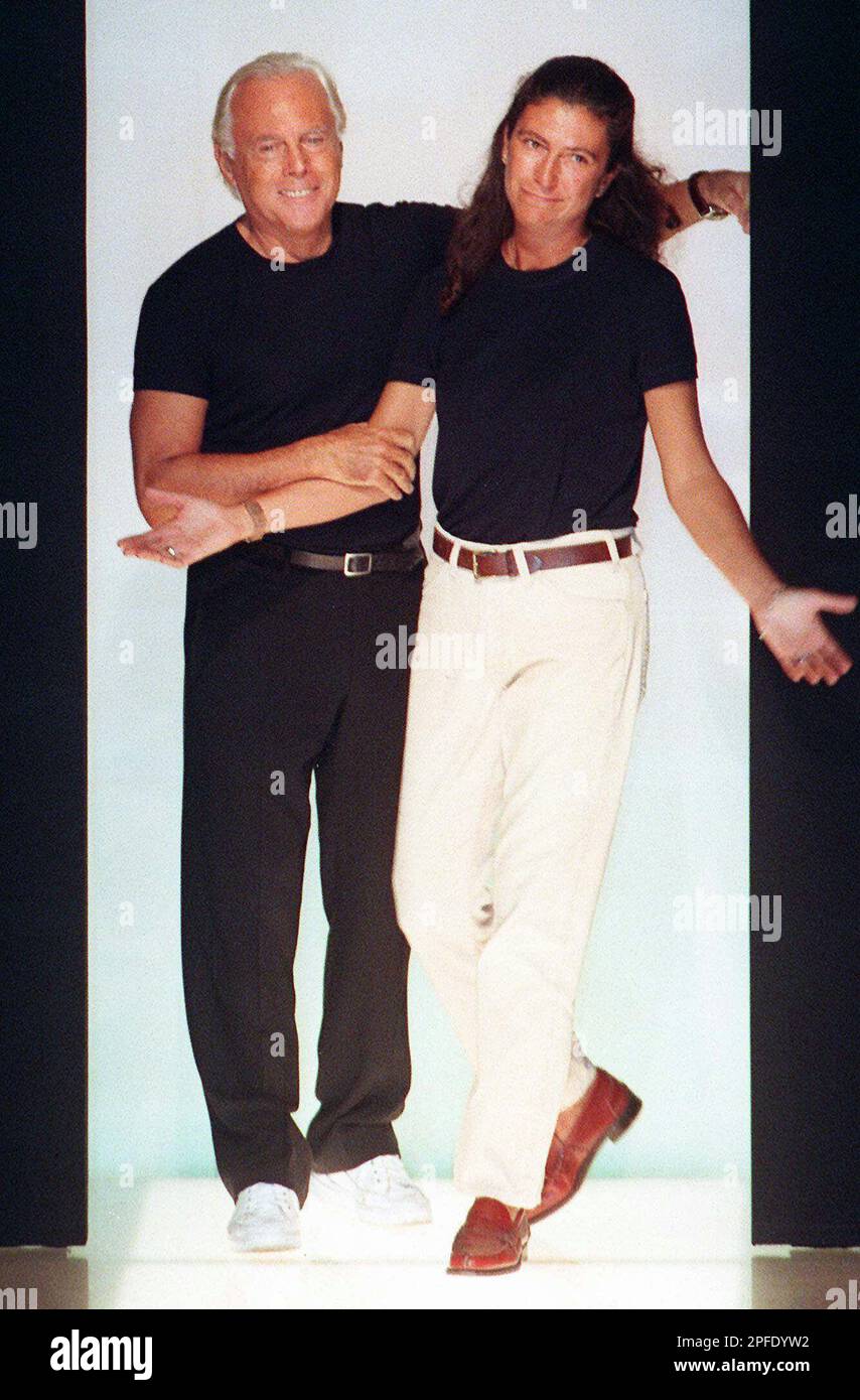 Italian fashion designer Giorgio Armani and his niece Silvana acknowledge the audience at the ...