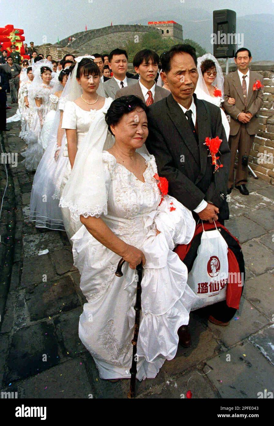 Sixty-nine-year-old Chen Shuzhen, left, and her groom Dong Luenxiang ...