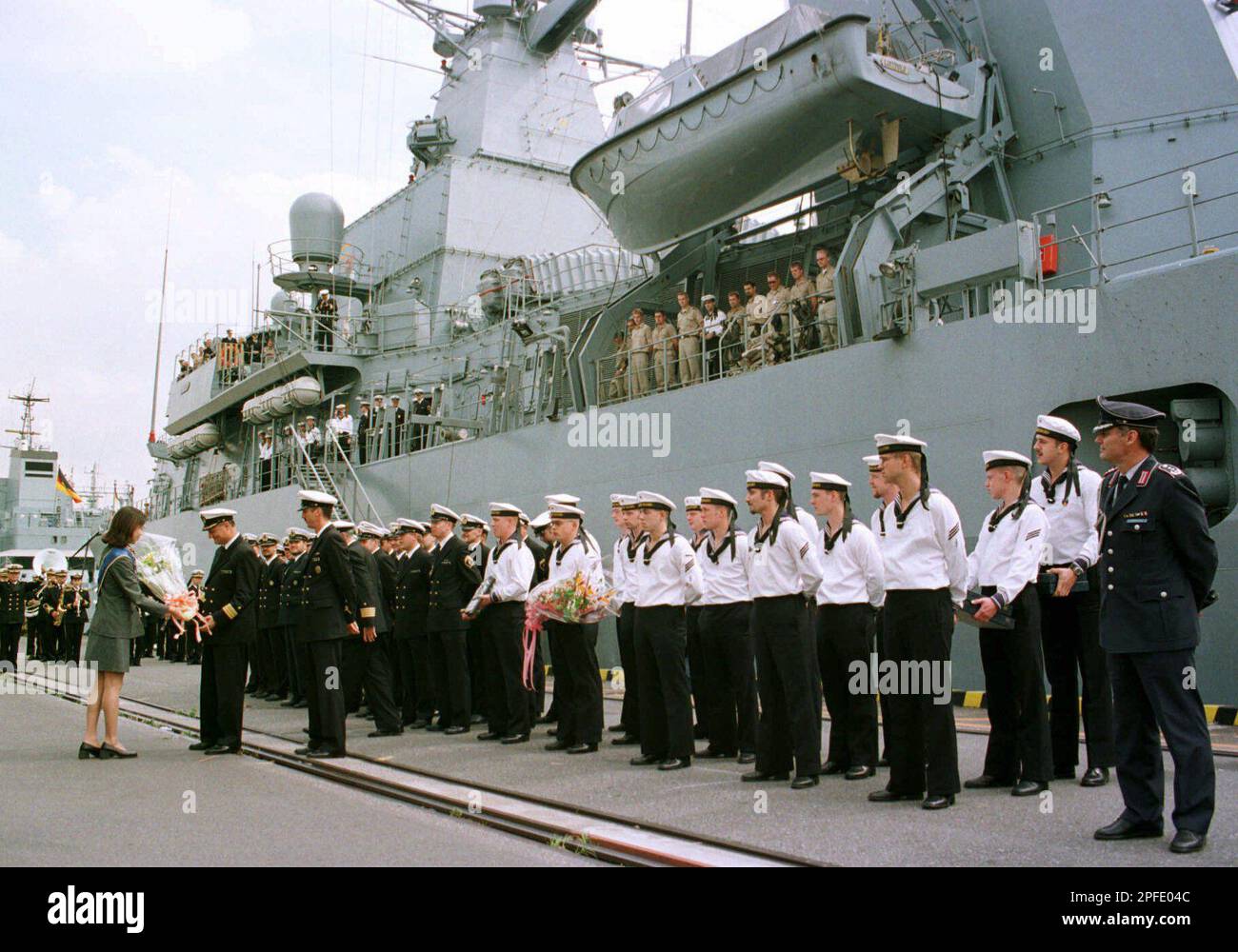Crew members of German frigate Bayern receive a welcome greetings from ...