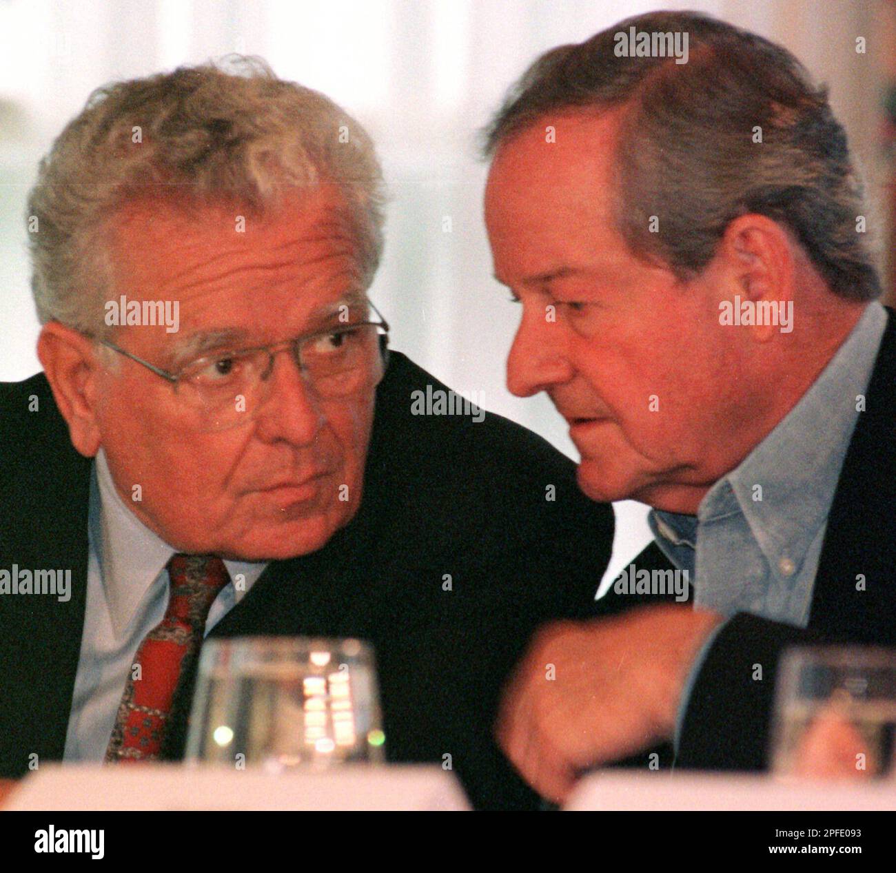 Colorado Gov. Roy Romer, left, confers with Indiana Gov. Frank O'Bannon ...