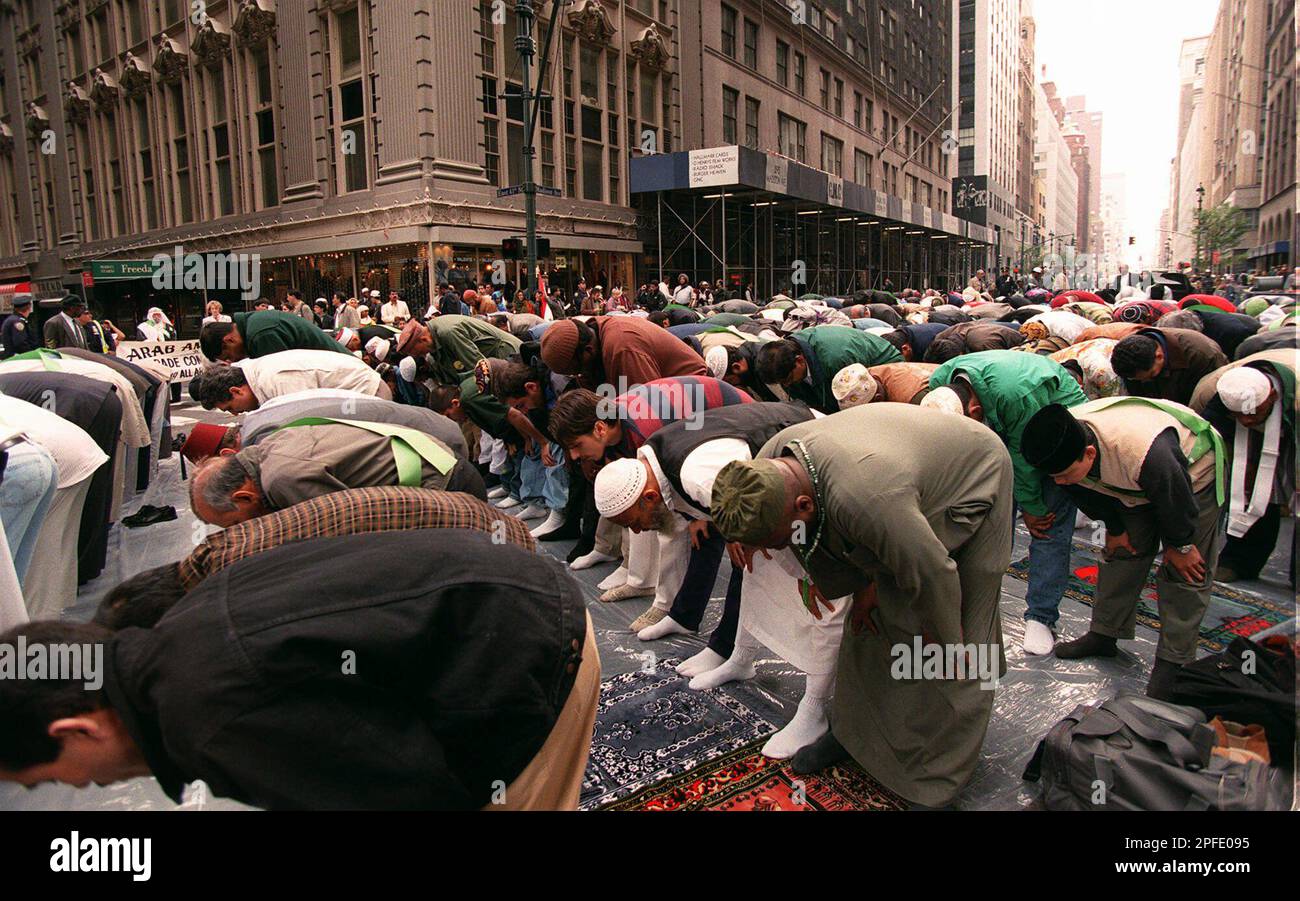 Islamic men bow for afternoon prayer on New York's Madison Ave. at 41st ...
