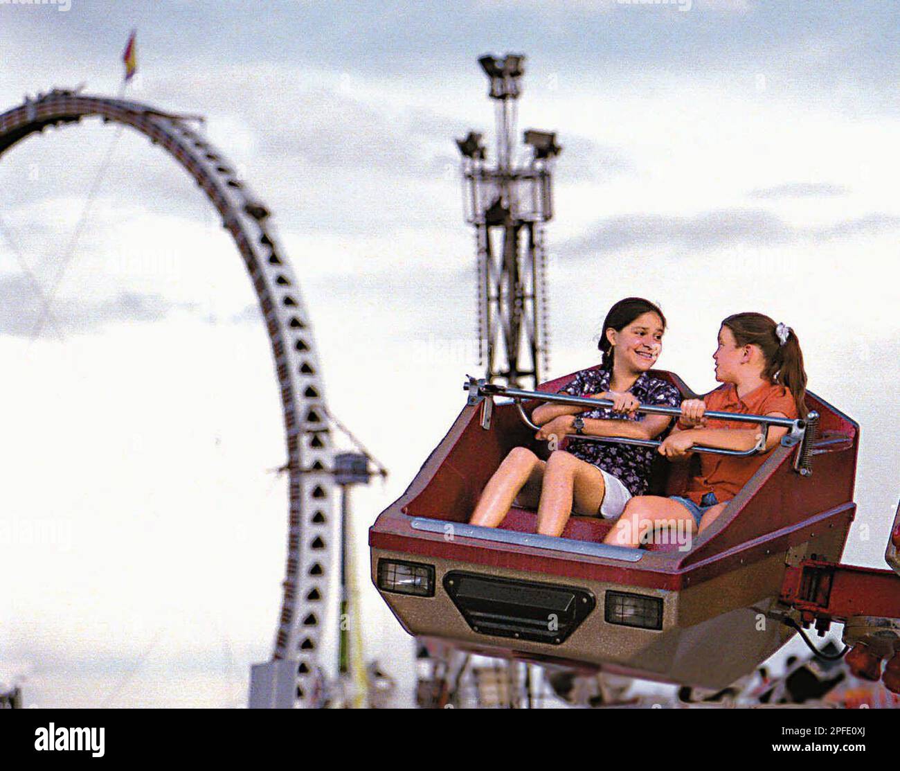 Marisa Pena, 11, left, and Kate Linthicum, 11, give each other pensive ...