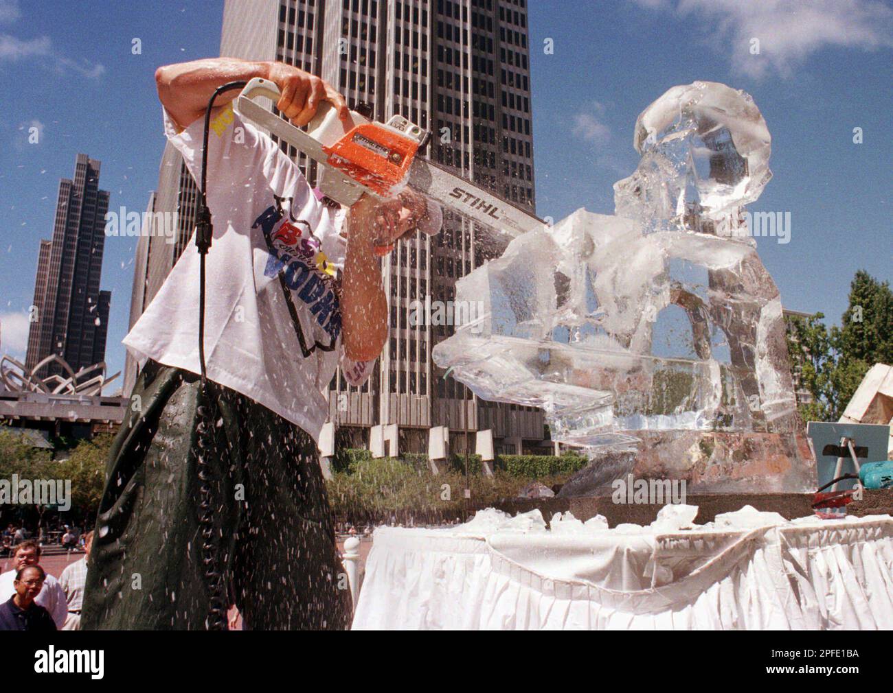 Using a chain saw, Ice sculptor Kevin Roscoe of Exquisite Ice ...