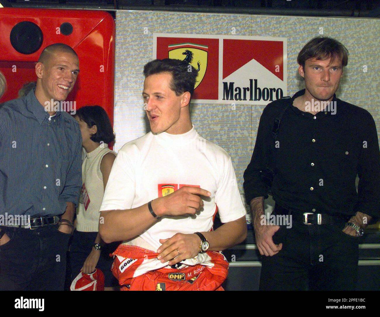 German driver Michael Schumacher, center, flanked by AC Milan's German ...