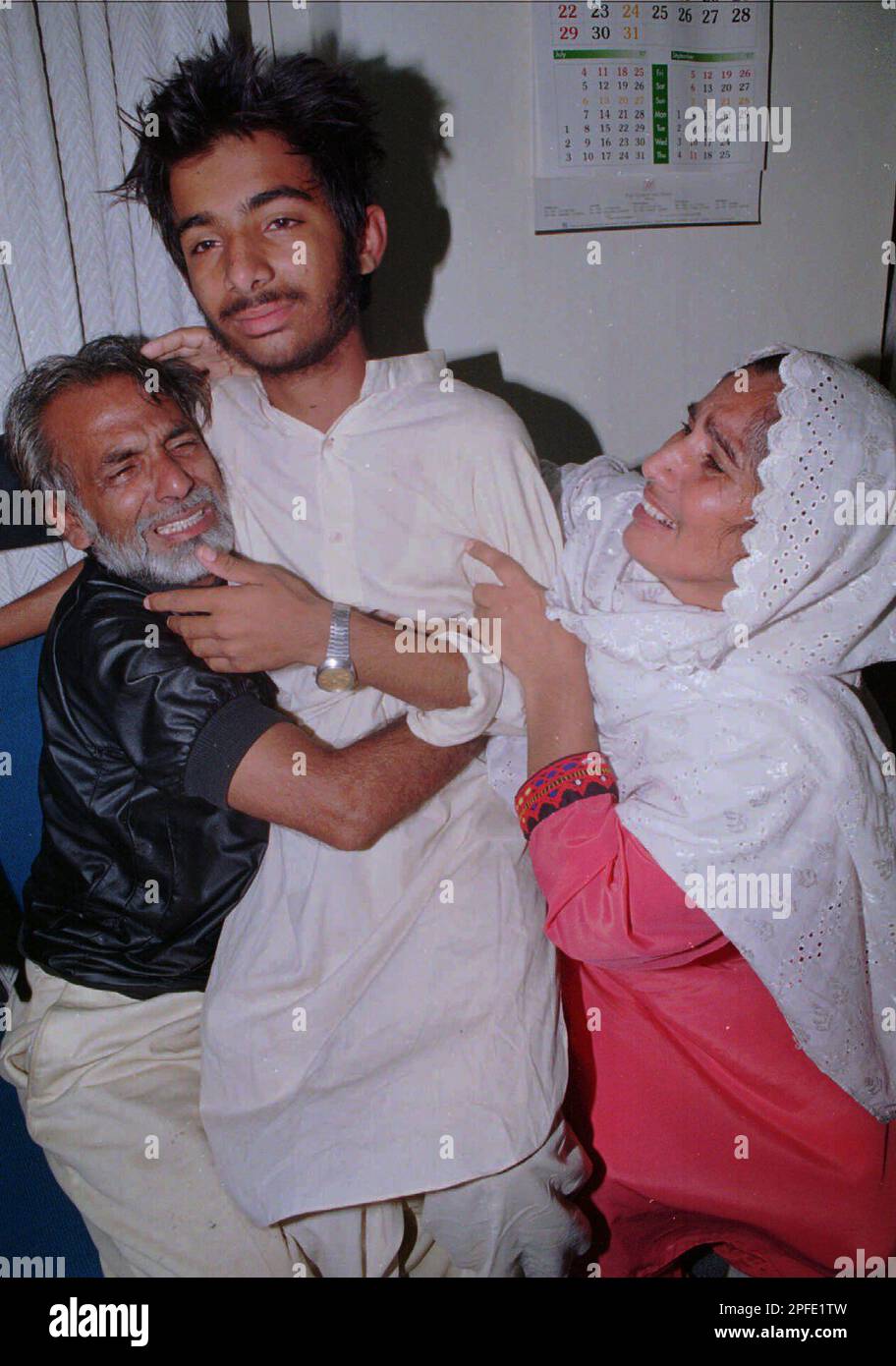 Thirteen years old Maroof Ahmad, center, who was taken to Afghanistan ...