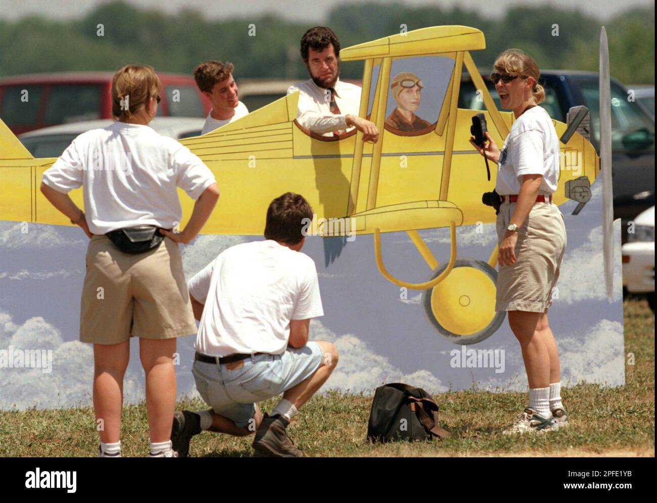 Wally Earhart, behind plane on right, fourth cousin to Amelia Earhart ...
